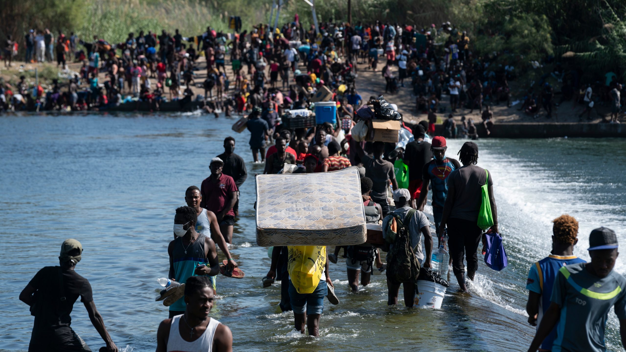 Border Surge: Migrants Cross River Obstacles - Immigration Reform News